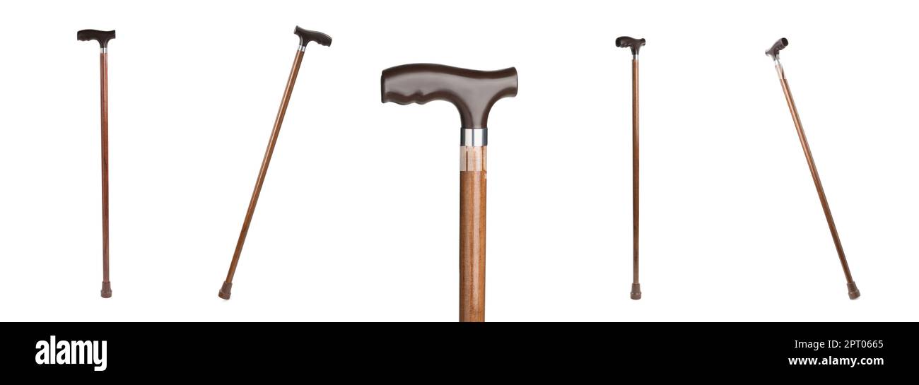 Set with elegant wooden walking canes on white background. Banner ...