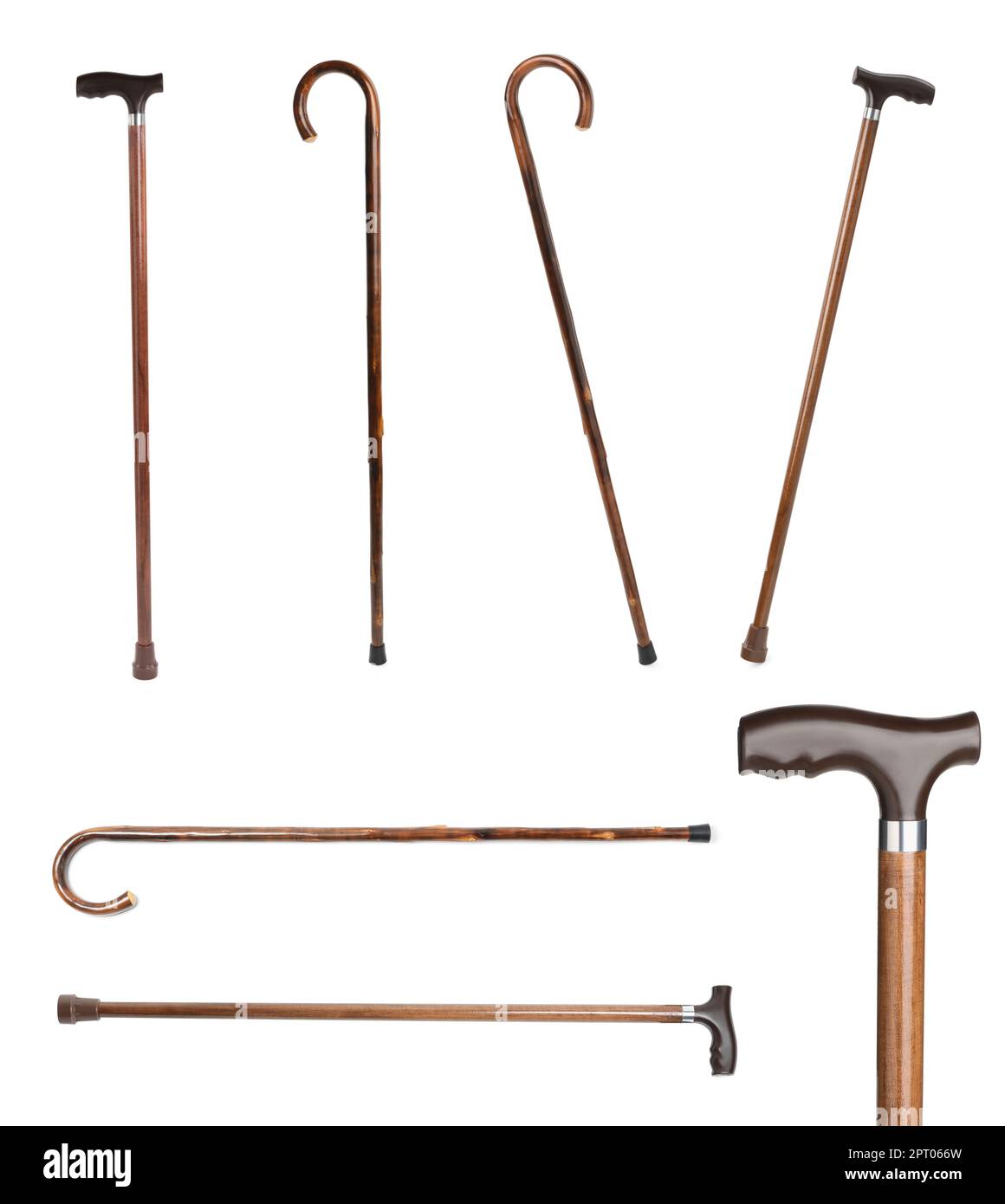 Set with elegant wooden walking canes on white background Stock Photo ...