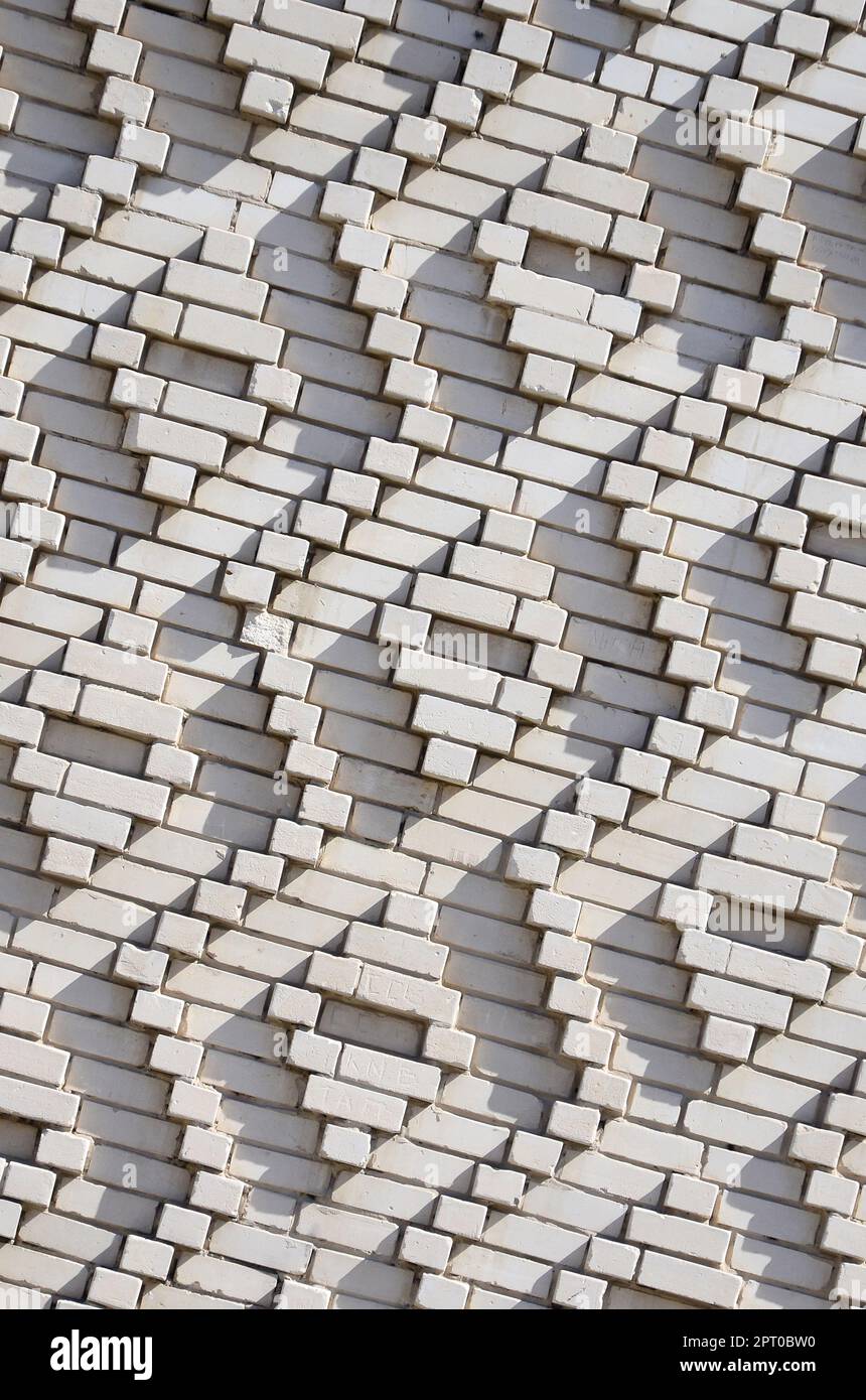 A pattern made of white bricks in the form of diamond shapes ...