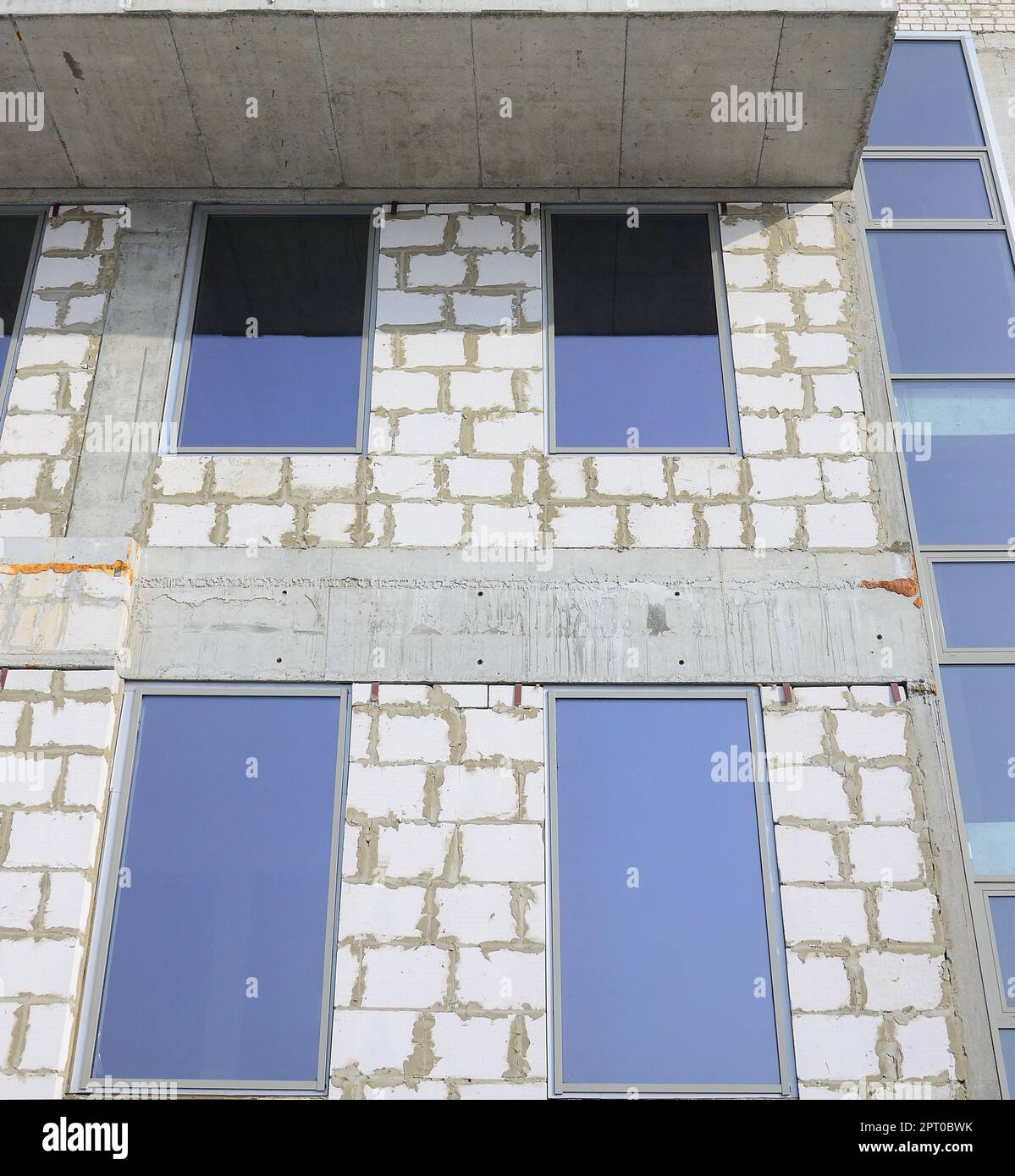 Fragment of an unfinished structure of a multi-storey building made of ...