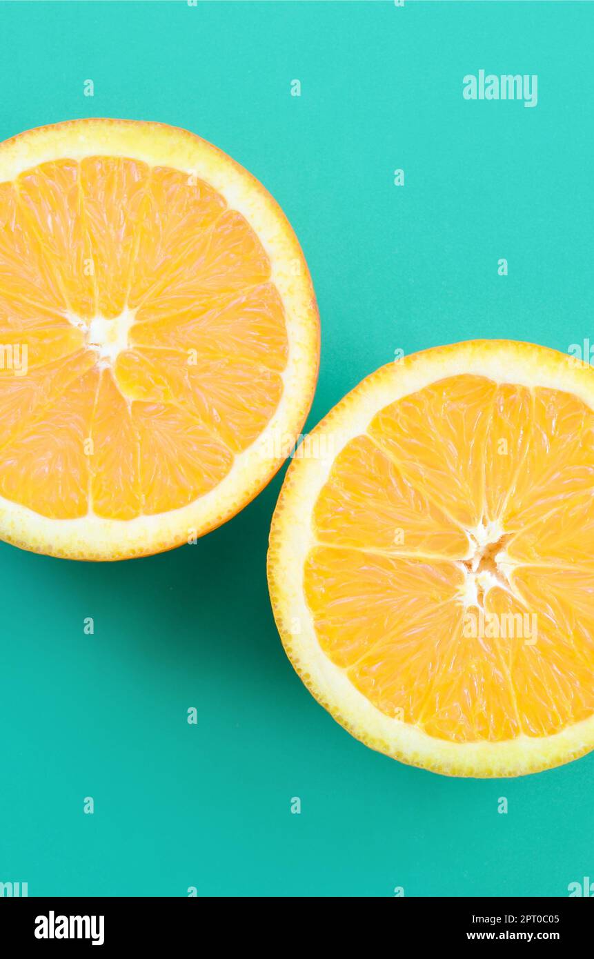 Top view of a several orange fruit slices on bright background in ...