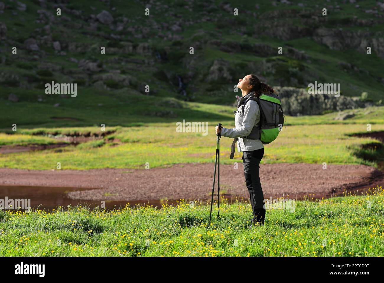 Full bofy profile of a hiker breathing fresh air in a riverside Stock ...