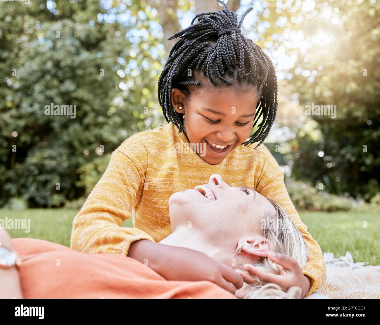 Family, adoption and park with a mother and daughter having fun while ...