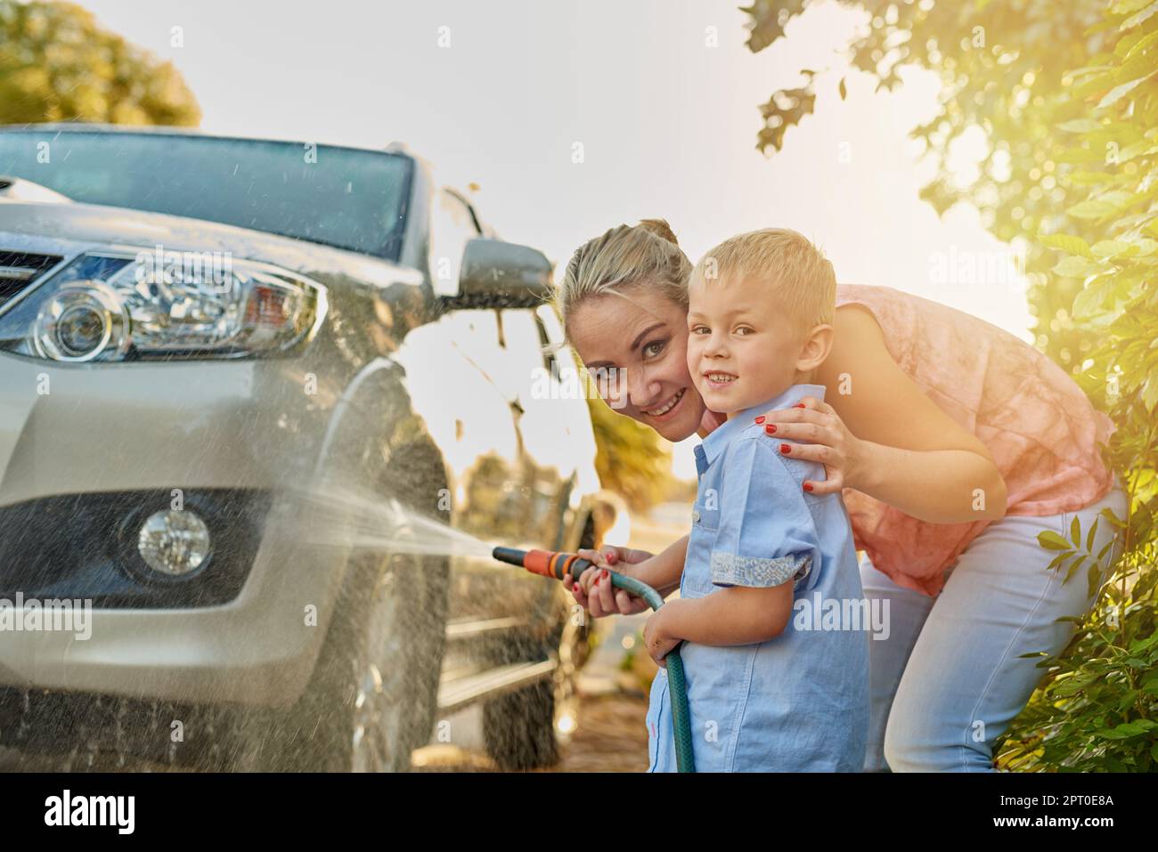 Child and women washing car together hi-res stock photography and ...