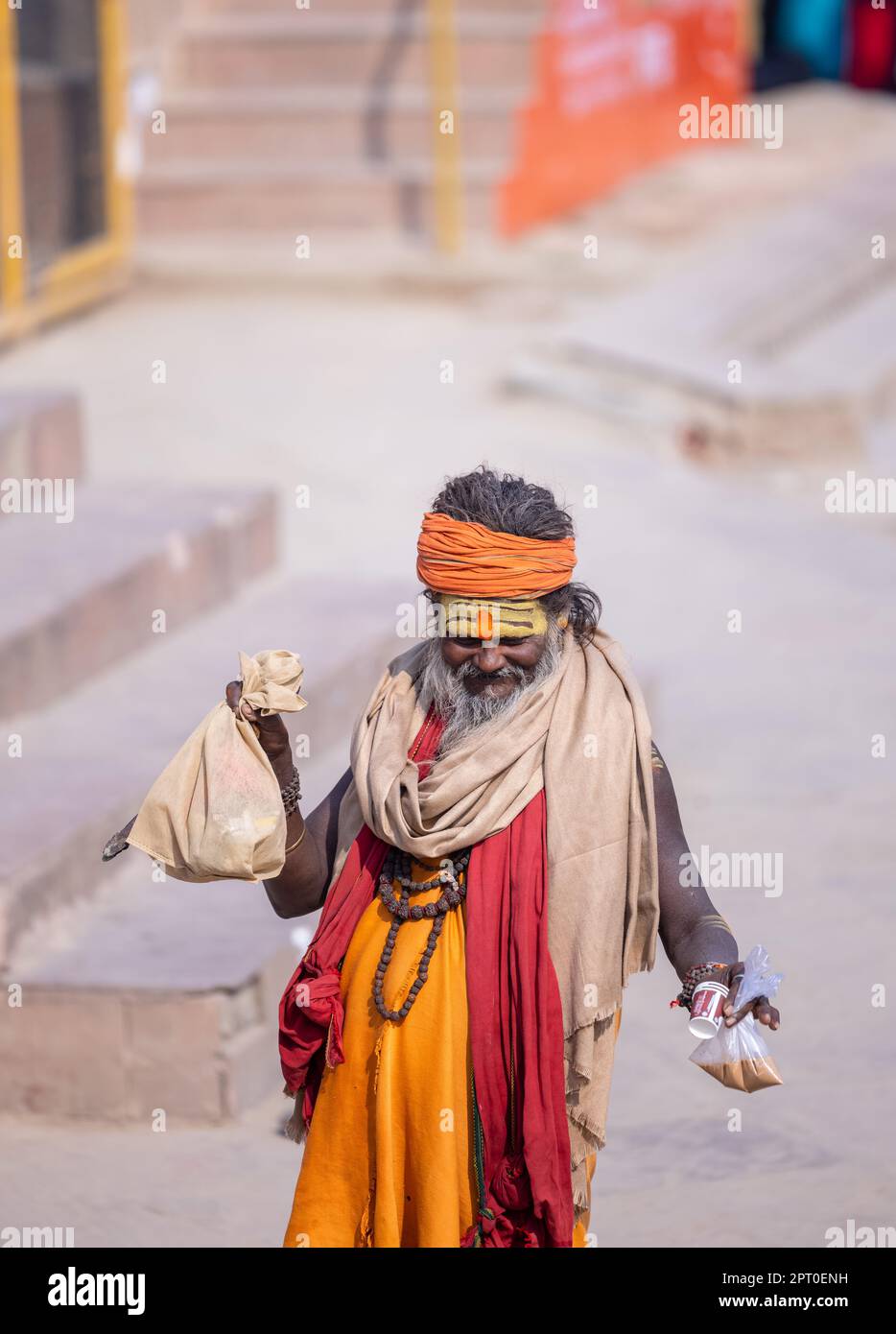 Portrait of Unidentified Indian sadhu baba walking on ghat near river ...