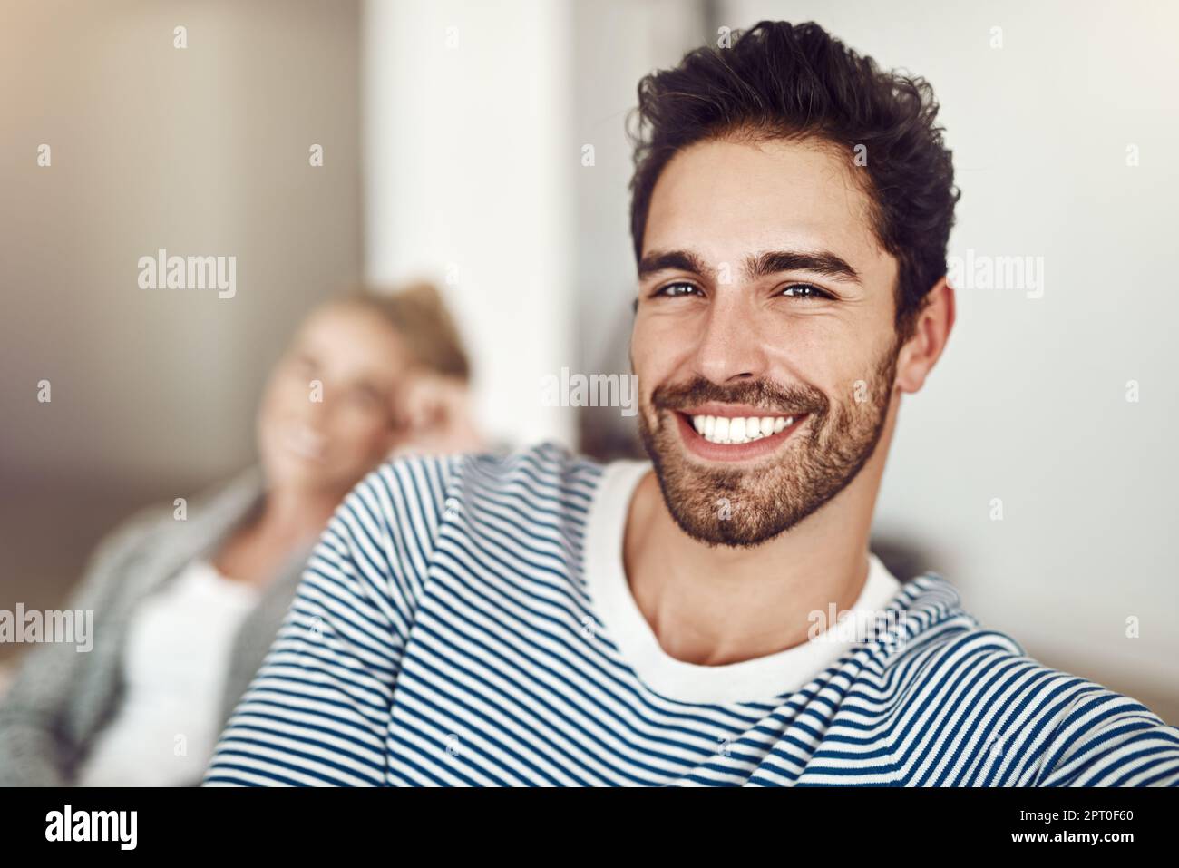 Im always up for a easy day at home. a young man sitting at home with ...