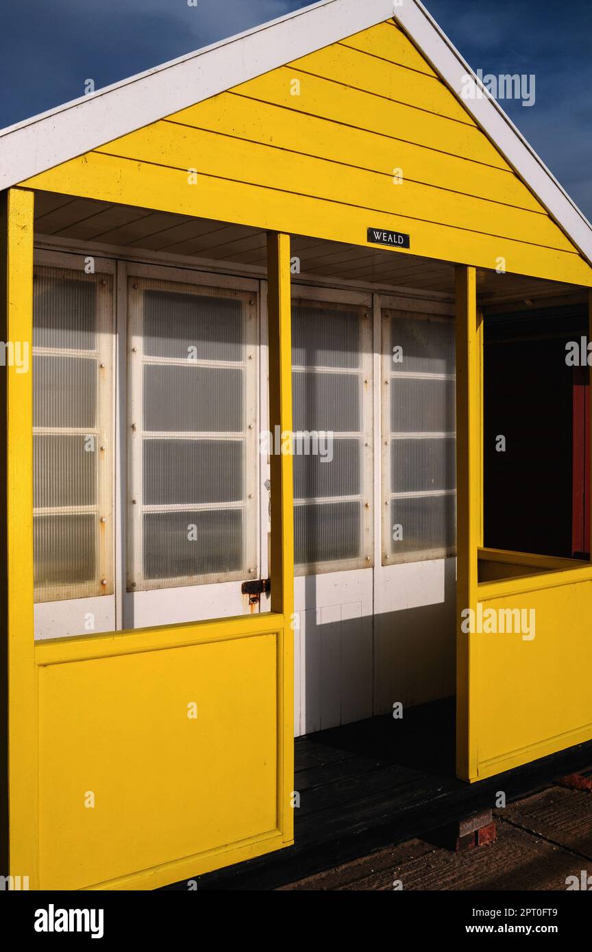 Bright yellow beach hut, cabin or bathing box in the seaside resort of ...