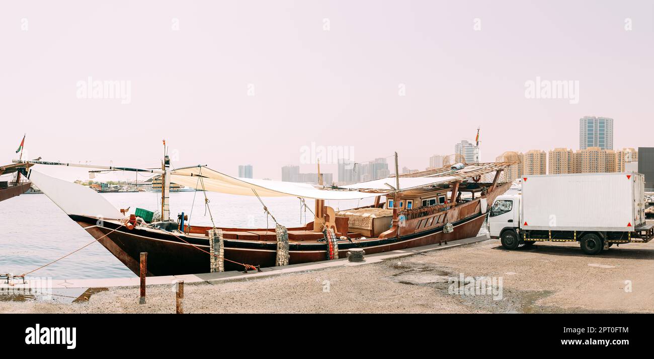 Dhow, sailboat, sailing vessel boat is moored to the city pier, jetty ...