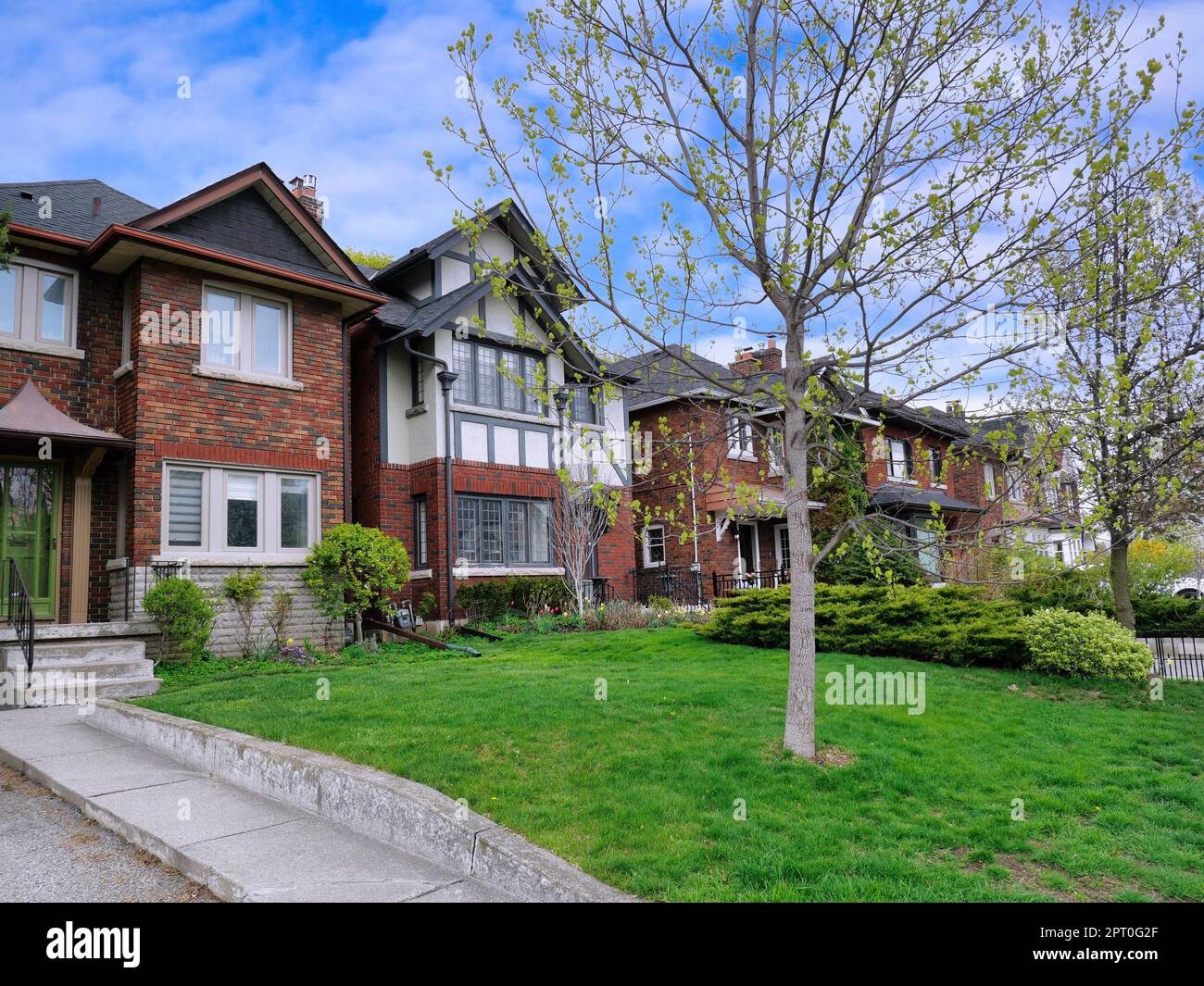 Middle class residential neighborhood with traditional detached houses ...