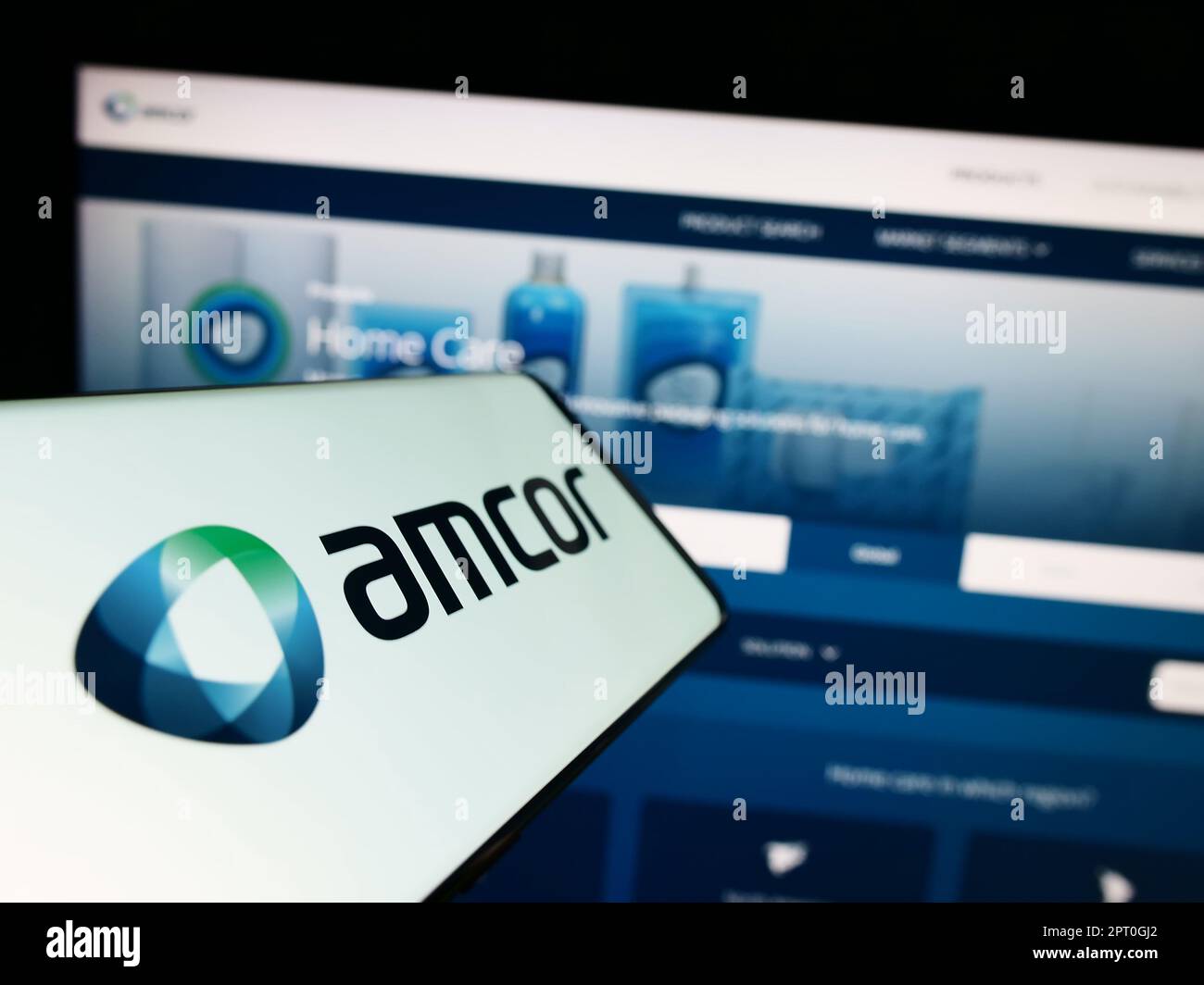 Smartphone with logo of packaging company Amcor plc on screen in front ...