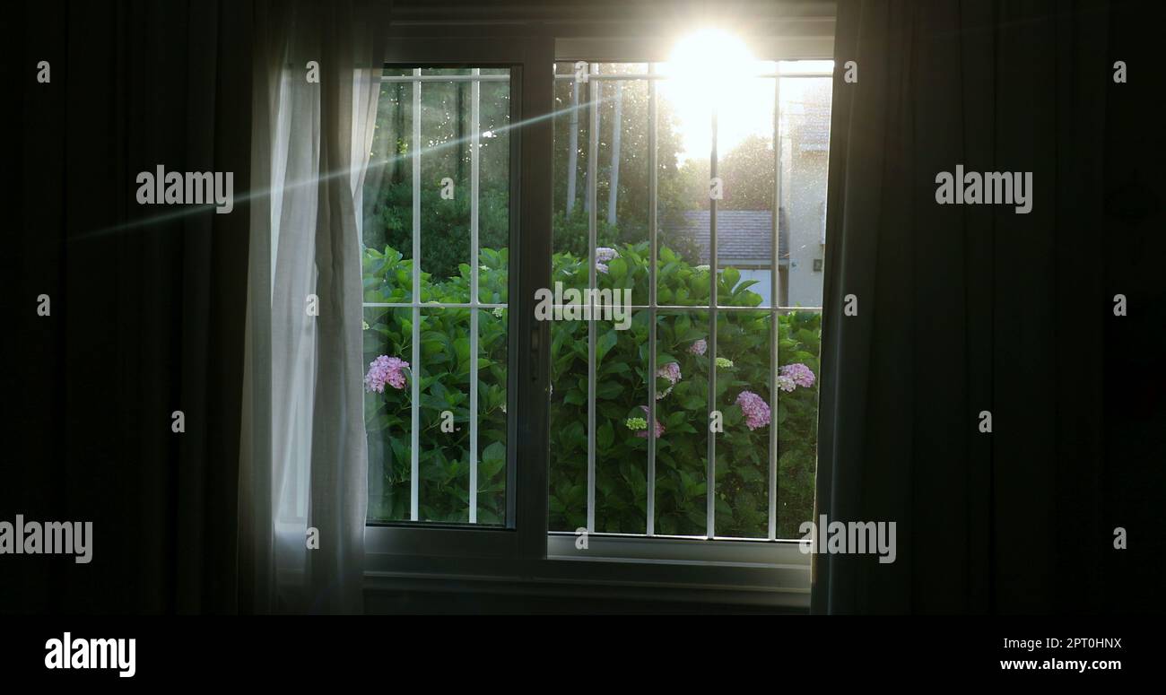 Sunflare shining through bedroom window sunset time Stock Photo - Alamy