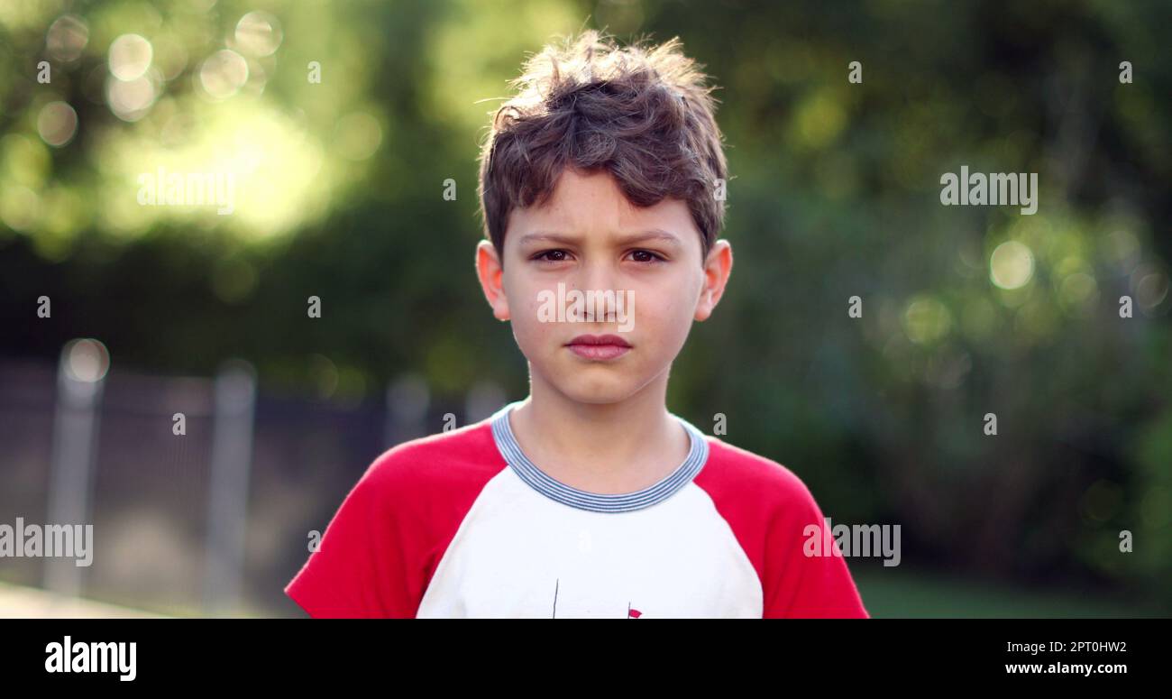 Upset child boy expression becoming serious. Portrait of kid changing ...