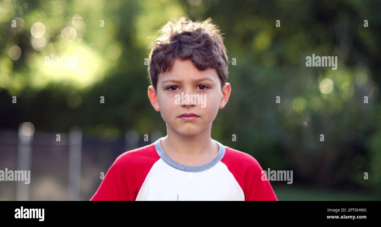 Upset child boy expression becoming serious. Portrait of kid changing ...