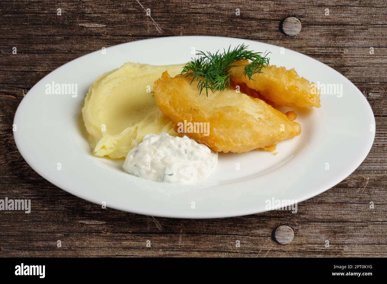 Fish fillet in batter with mashed potato Stock Photo - Alamy