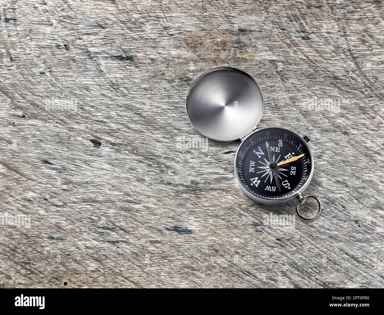 Compass on Vintage wood texture background. Travel destination and ...