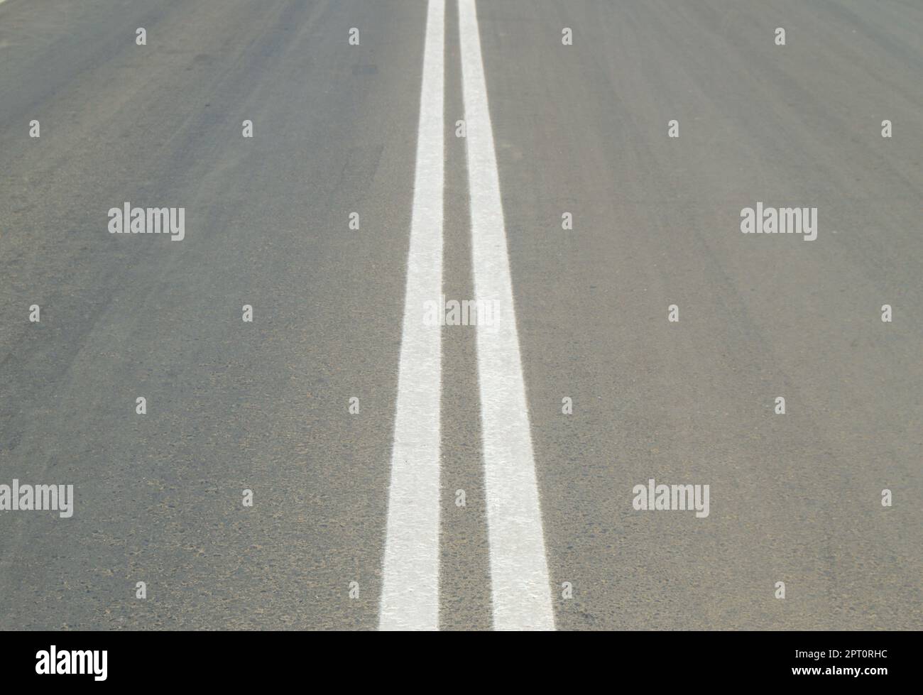 Markings on the road - The double solid line Stock Photo - Alamy