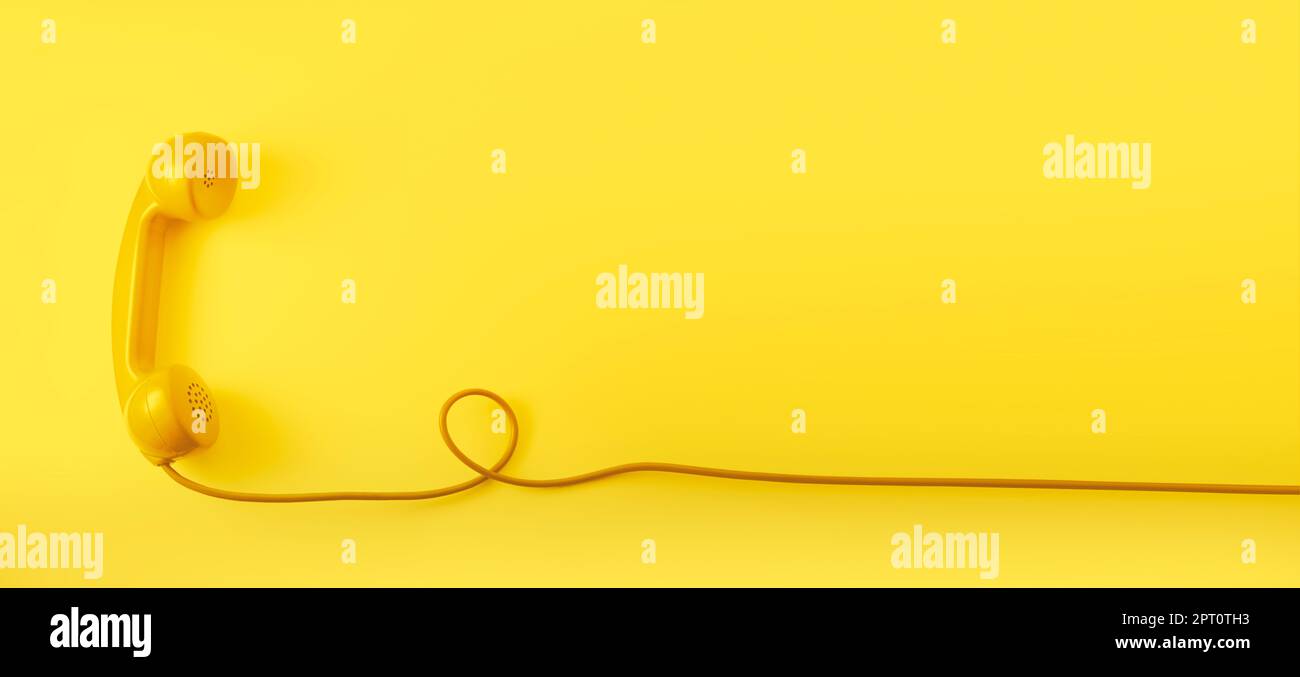 A yellow vintage dial telephone handset with yellow background Stock ...