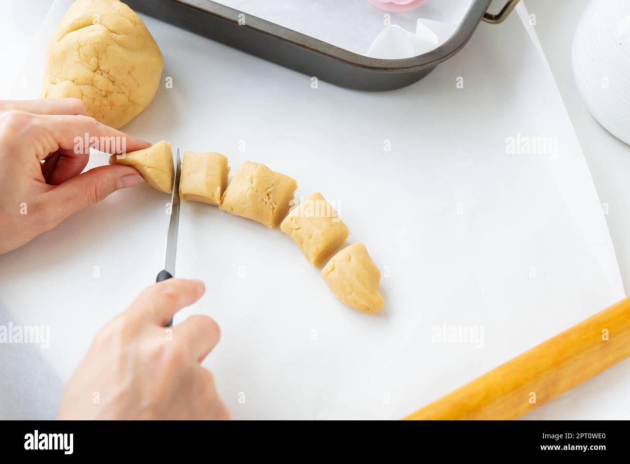 The process of making cookies with shapes in the form of flowers, a ...