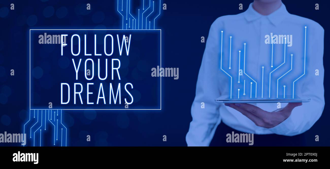 Sign displaying Follow Your Dreams, Word Written on motivational and ...