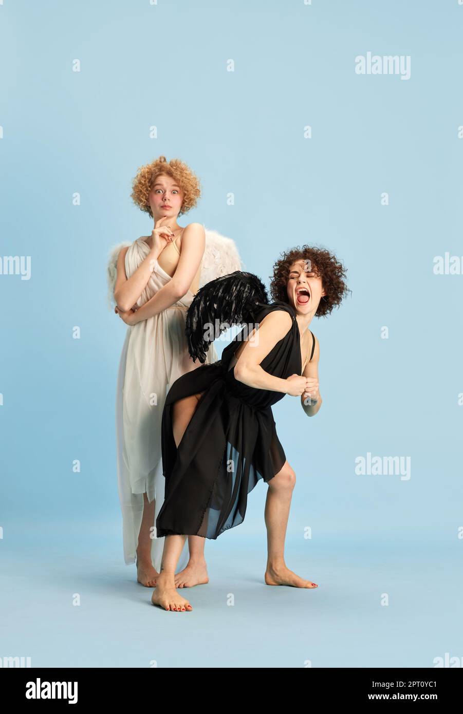 Portrait of two women in image of innocent angel and emotional devil ...