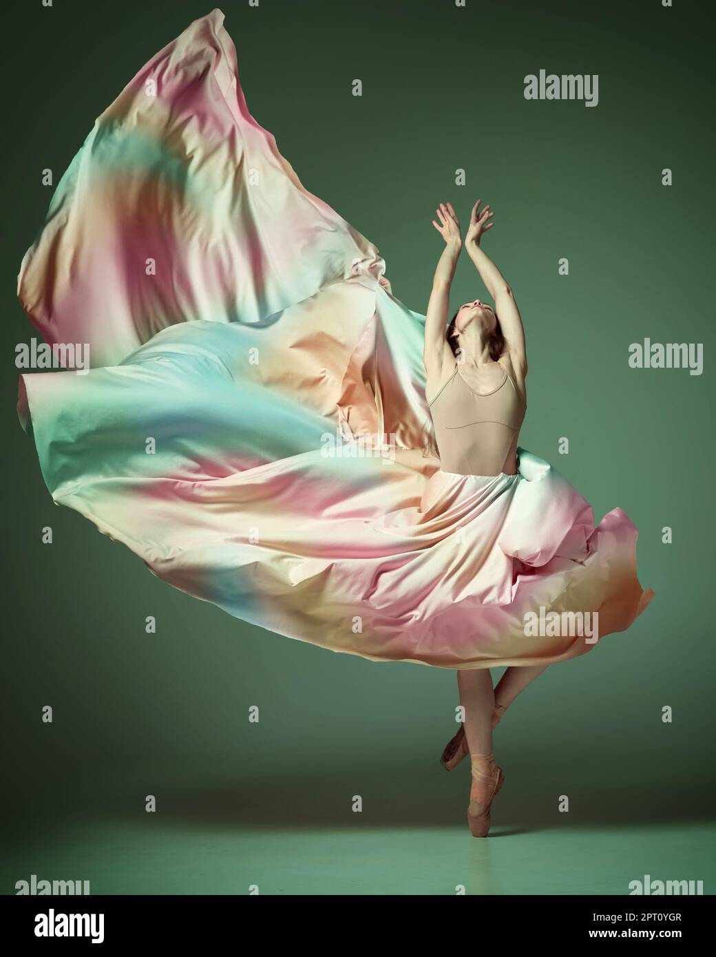 Charming ballerina dancing elegant, grace movement with flying fabric ...