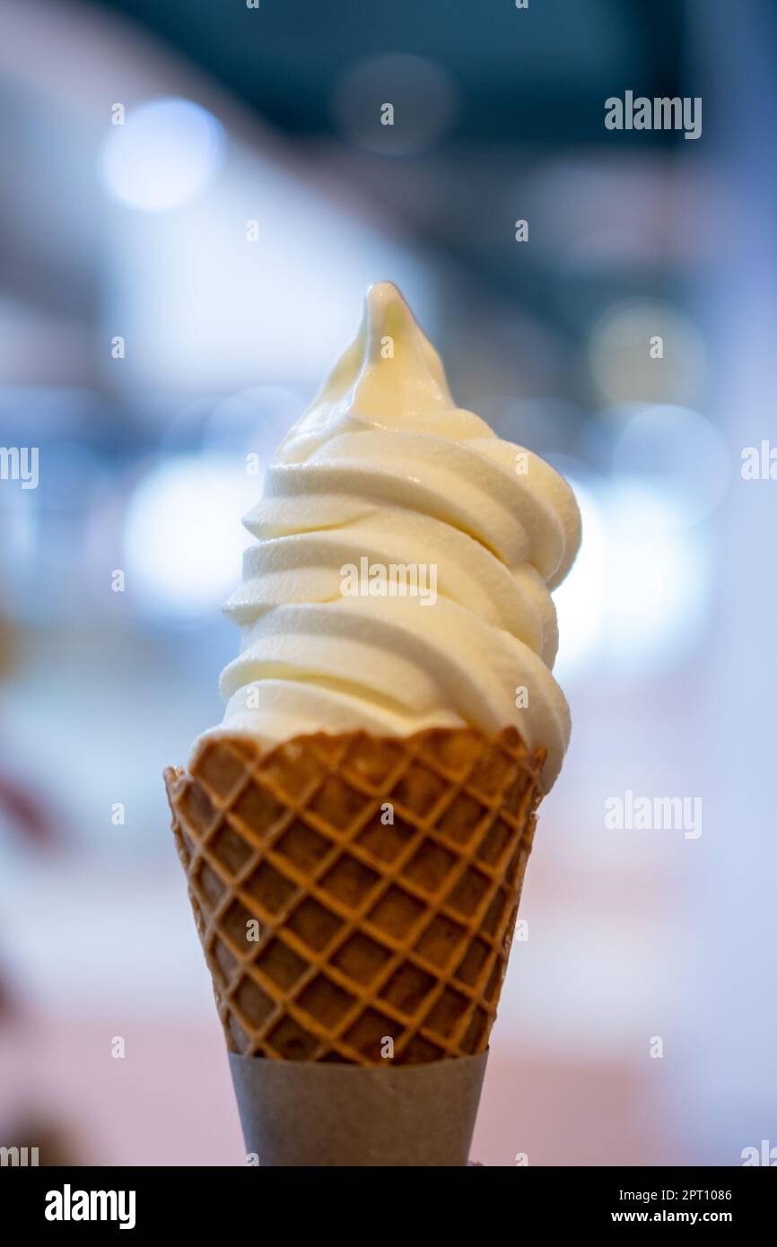 Vanilla Ice cream with waffle cone. blur background Stock Photo - Alamy
