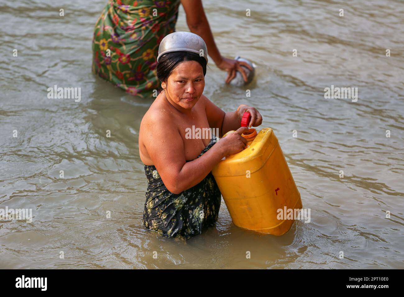 Burmese woman bathing & washing during Southeast Asia heatwave, life ...