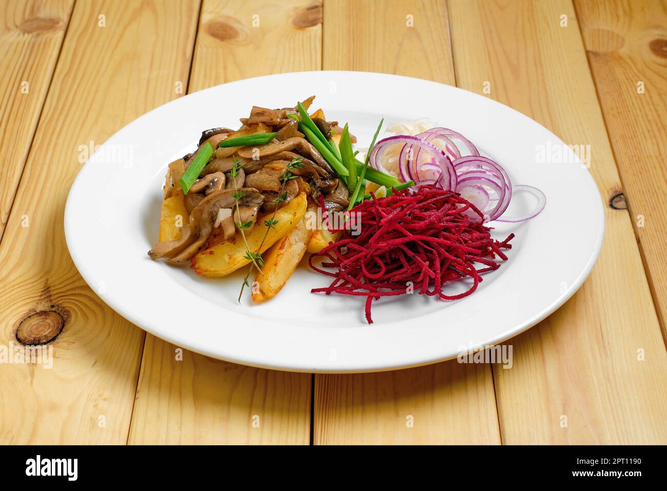 Fried potato, beetroot, pickled cabbage and mushrooms Stock Photo - Alamy