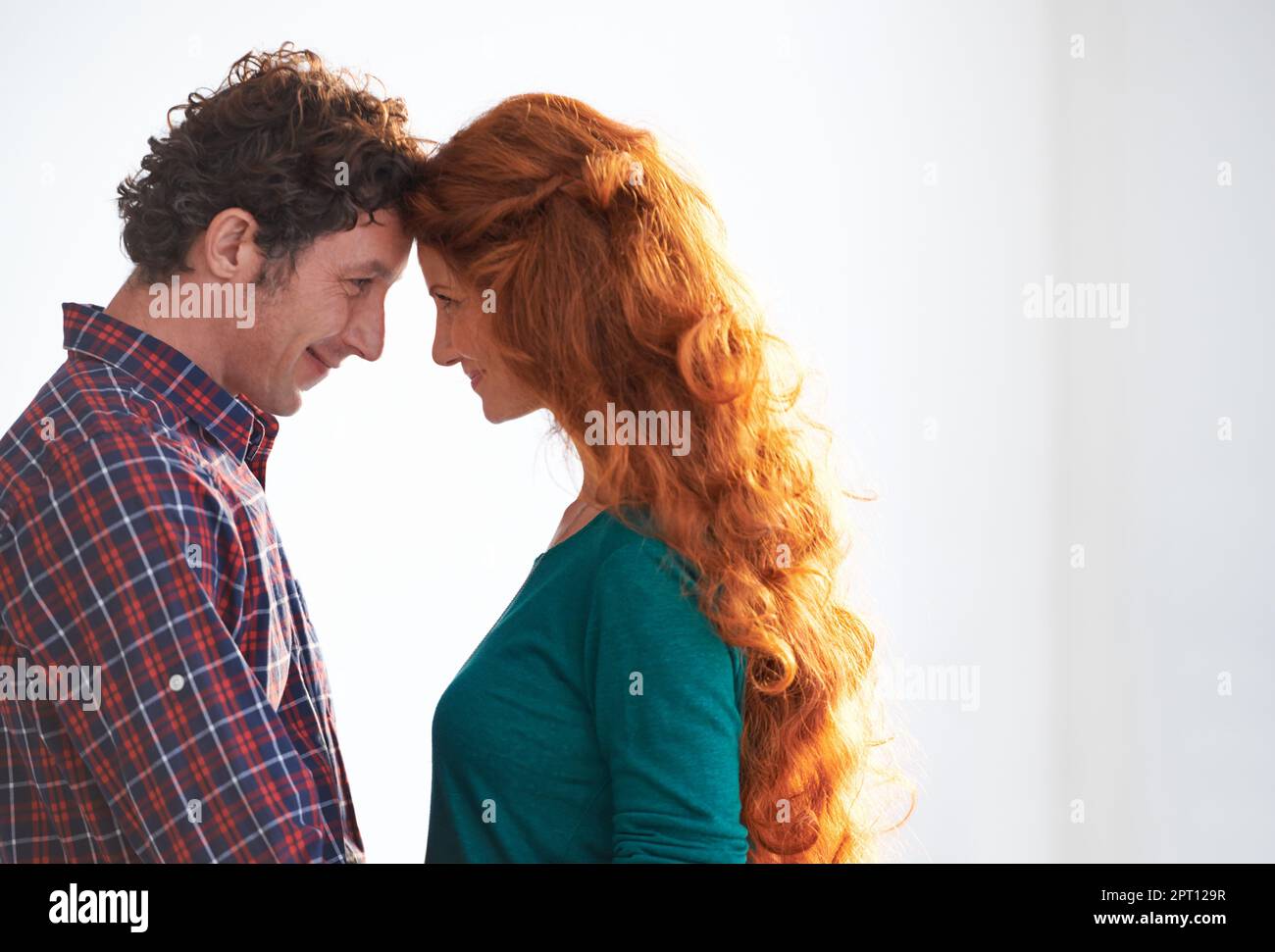 Love me tender. a loving young couple being affectionate Stock Photo ...