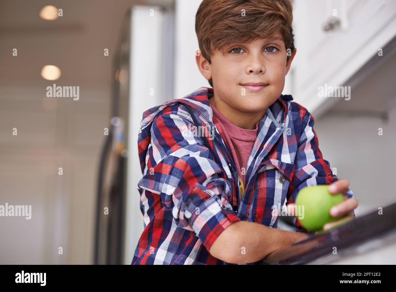 Boy eating apple interior hi-res stock photography and images - Alamy