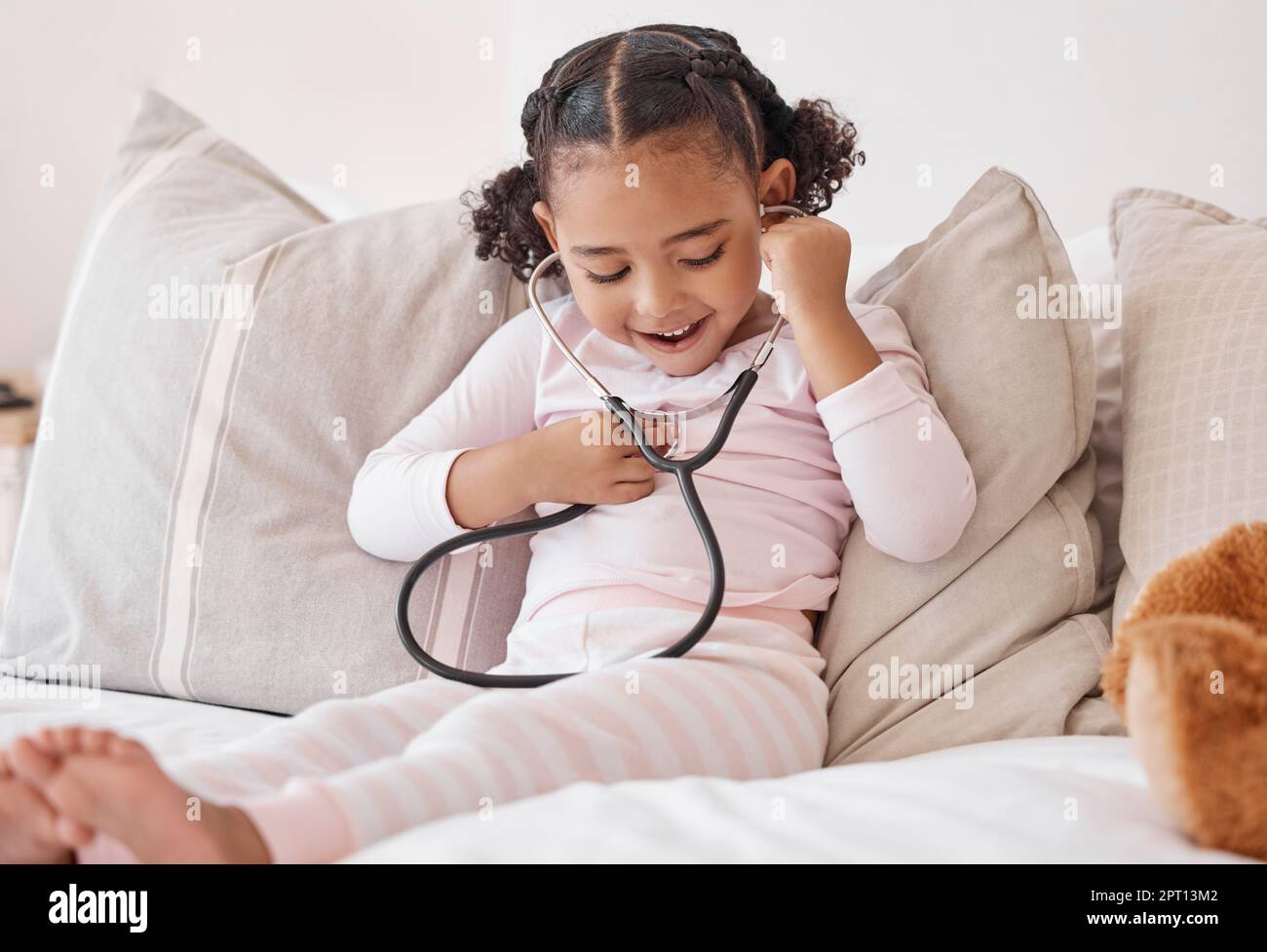Happy girl, doctor stethoscope and listening to heartbeat sound with ...