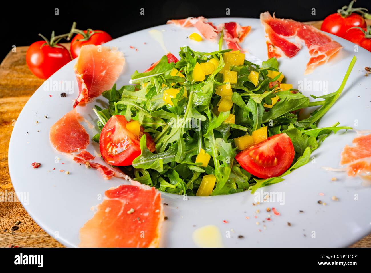 Rocket salad with dried Spanish ham Stock Photo - Alamy