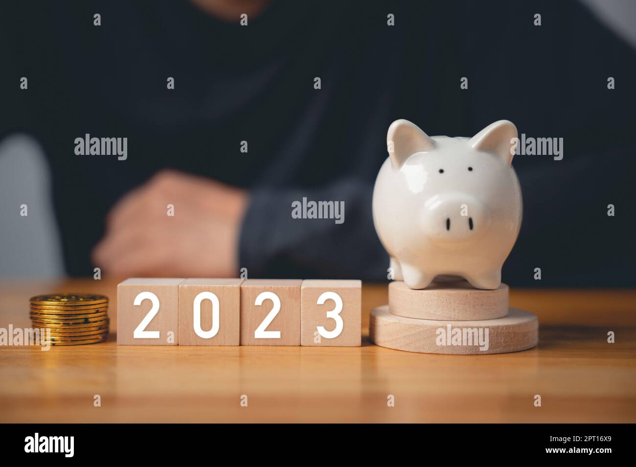 Happy New Year 2023. Businessman with wood cubes block number years ...