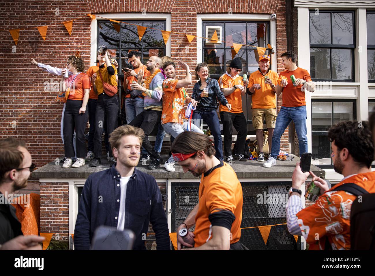AMSTERDAM - Revelers in the center of the capital on King's Day. Stages ...