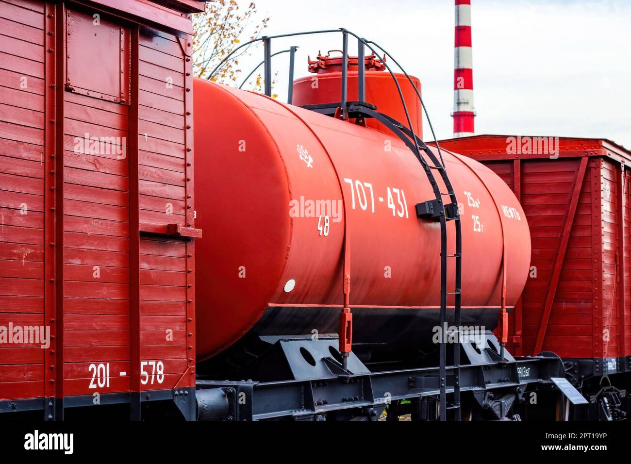Red retro train cistern wagon for petroleum and oil delivery by railway ...