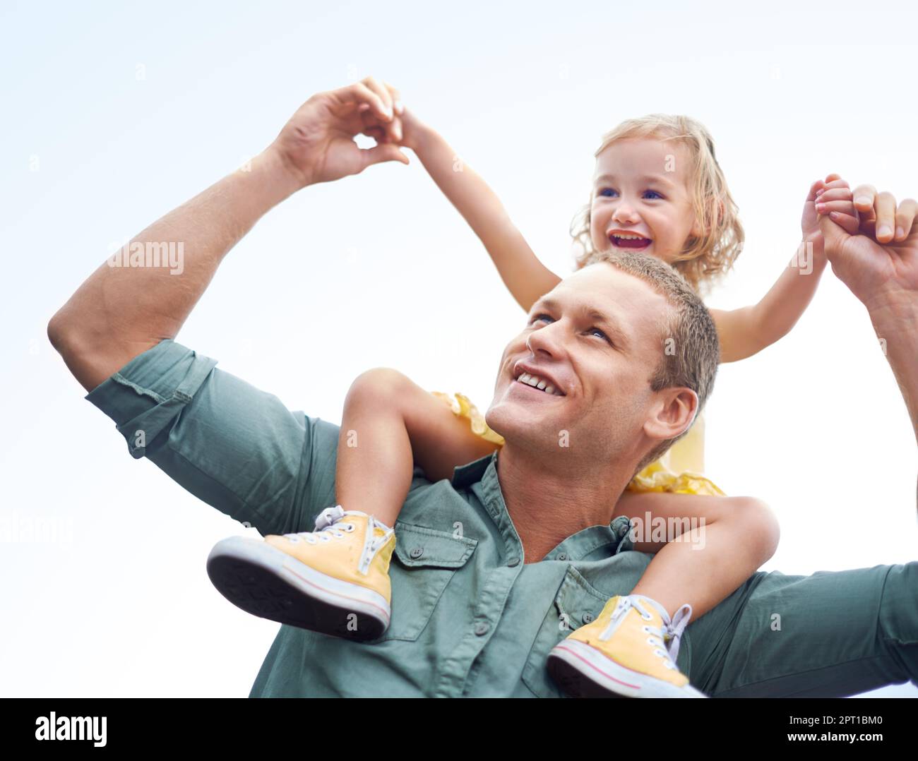 Child sitting on dads shoulders hi-res stock photography and images - Alamy