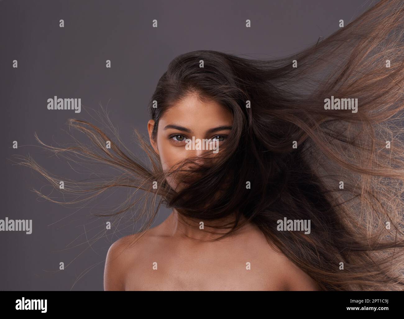 Young woman with windswept hair hi-res stock photography and images - Alamy