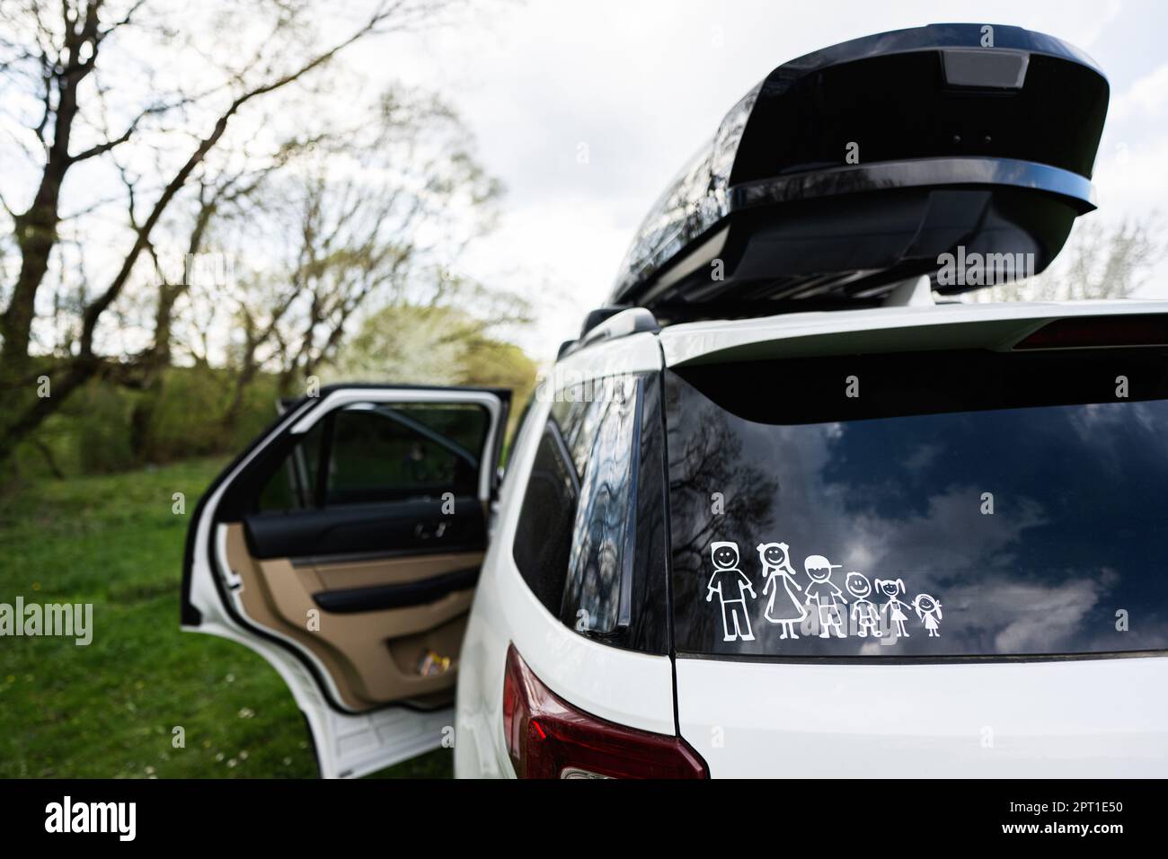 Happy family on board. Sticker on the back of car with roof box. Four ...