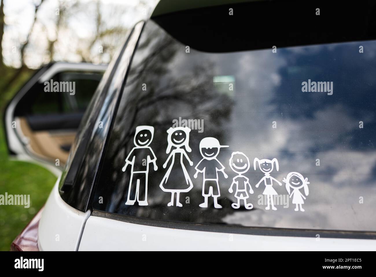 Happy family on board. Sticker on the back of car. Four kids Stock ...