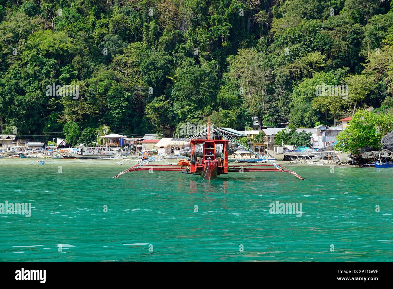 wooden traditional outrigger boats on palawan island at the philippines ...