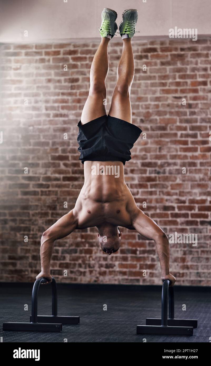 Raw power. Full length shot of a young man working out in the gym Stock ...