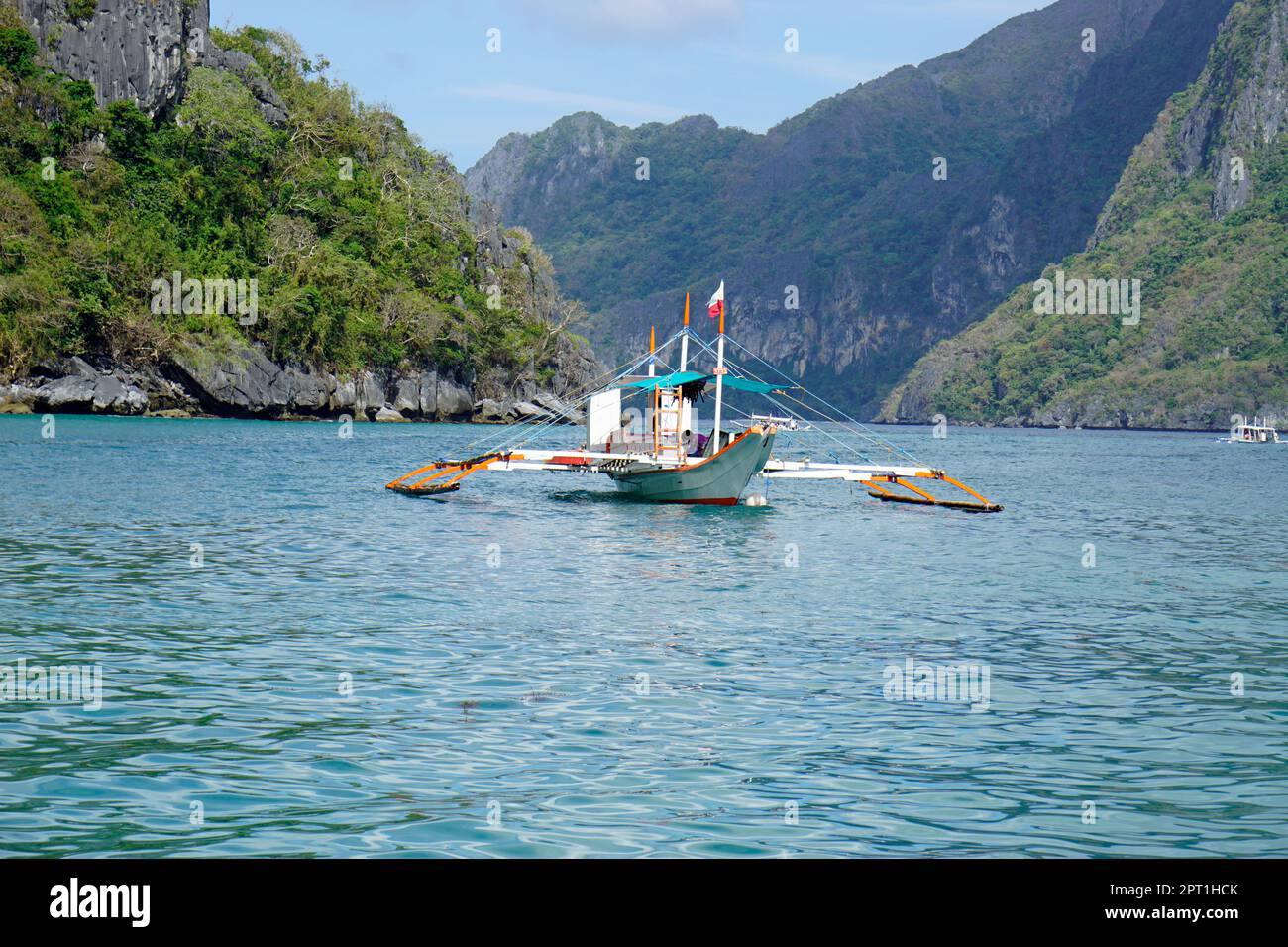 wooden traditional outrigger boats on palawan island at the philippines ...