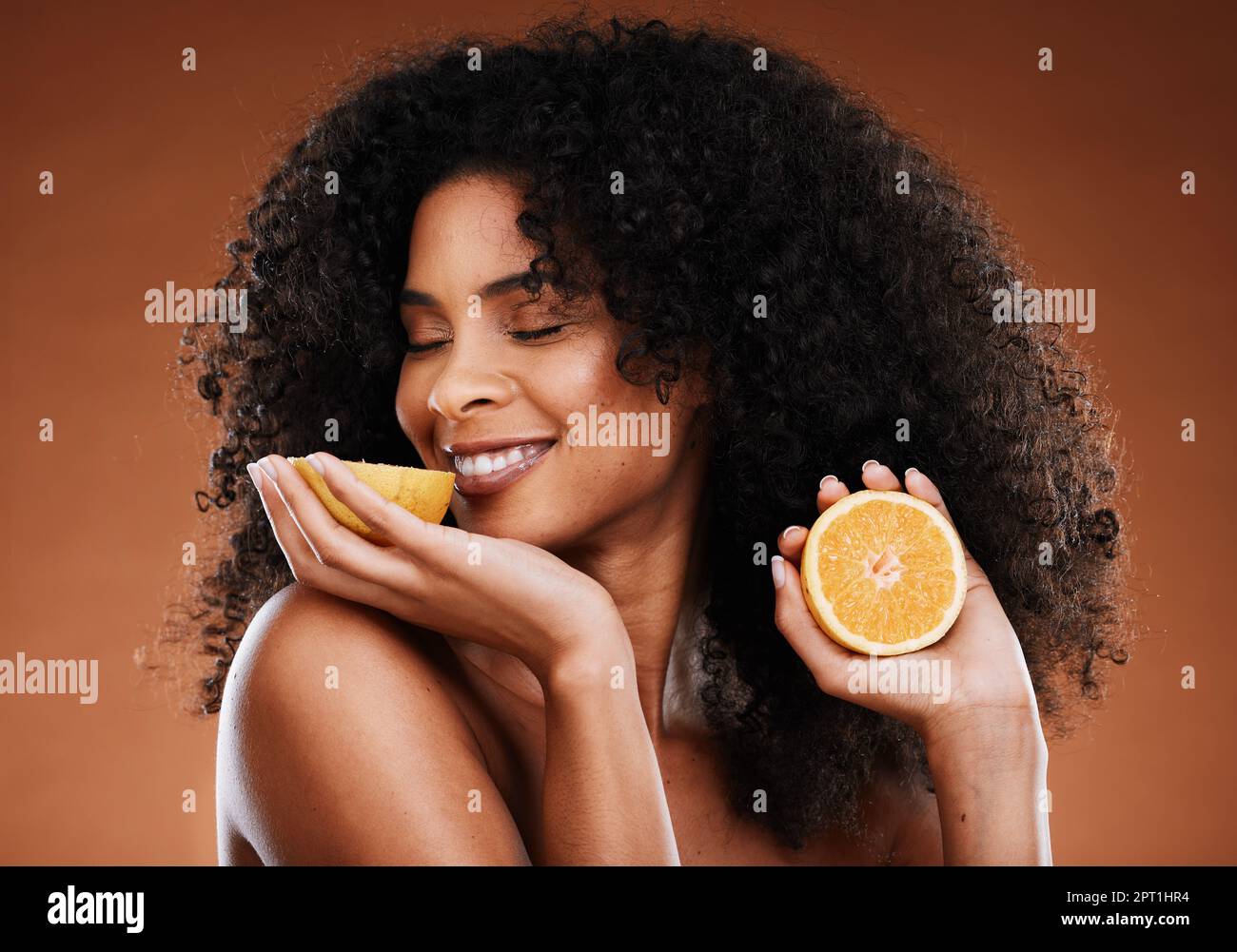 Lemon, natural beauty and black woman in studio for skincare, hair care ...