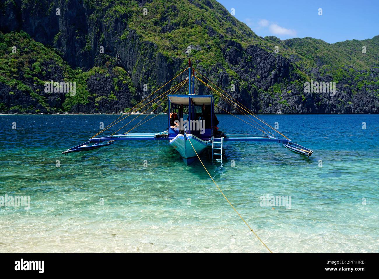 wooden traditional outrigger boats on palawan island at the philippines ...