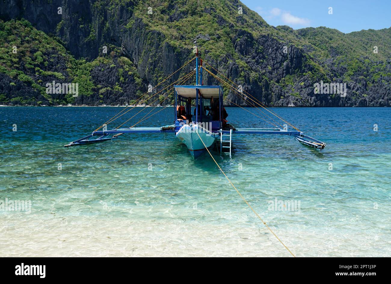 wooden traditional outrigger boats on palawan island at the philippines ...