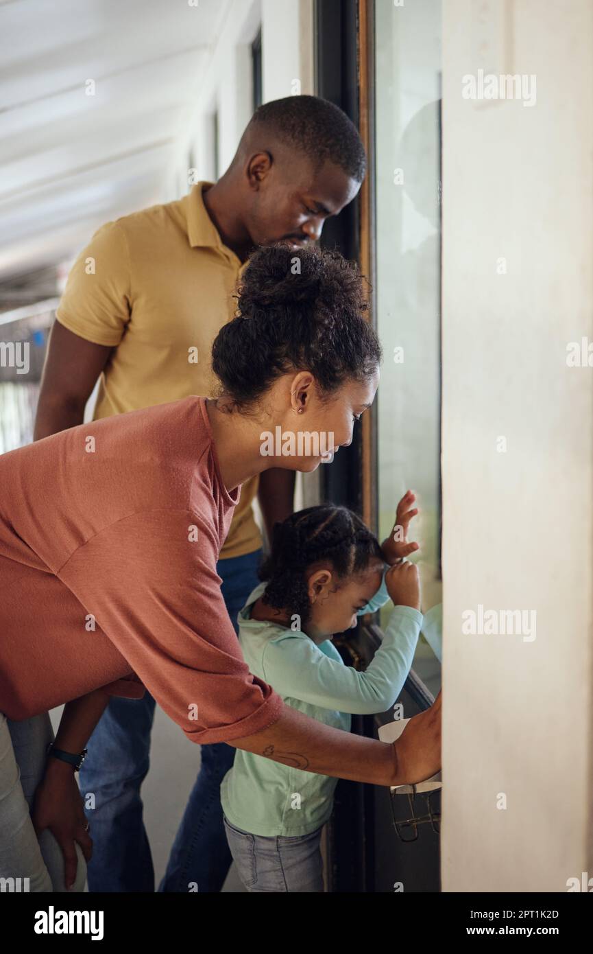 Family, love and animal shelter with a girl, mother and father looking ...