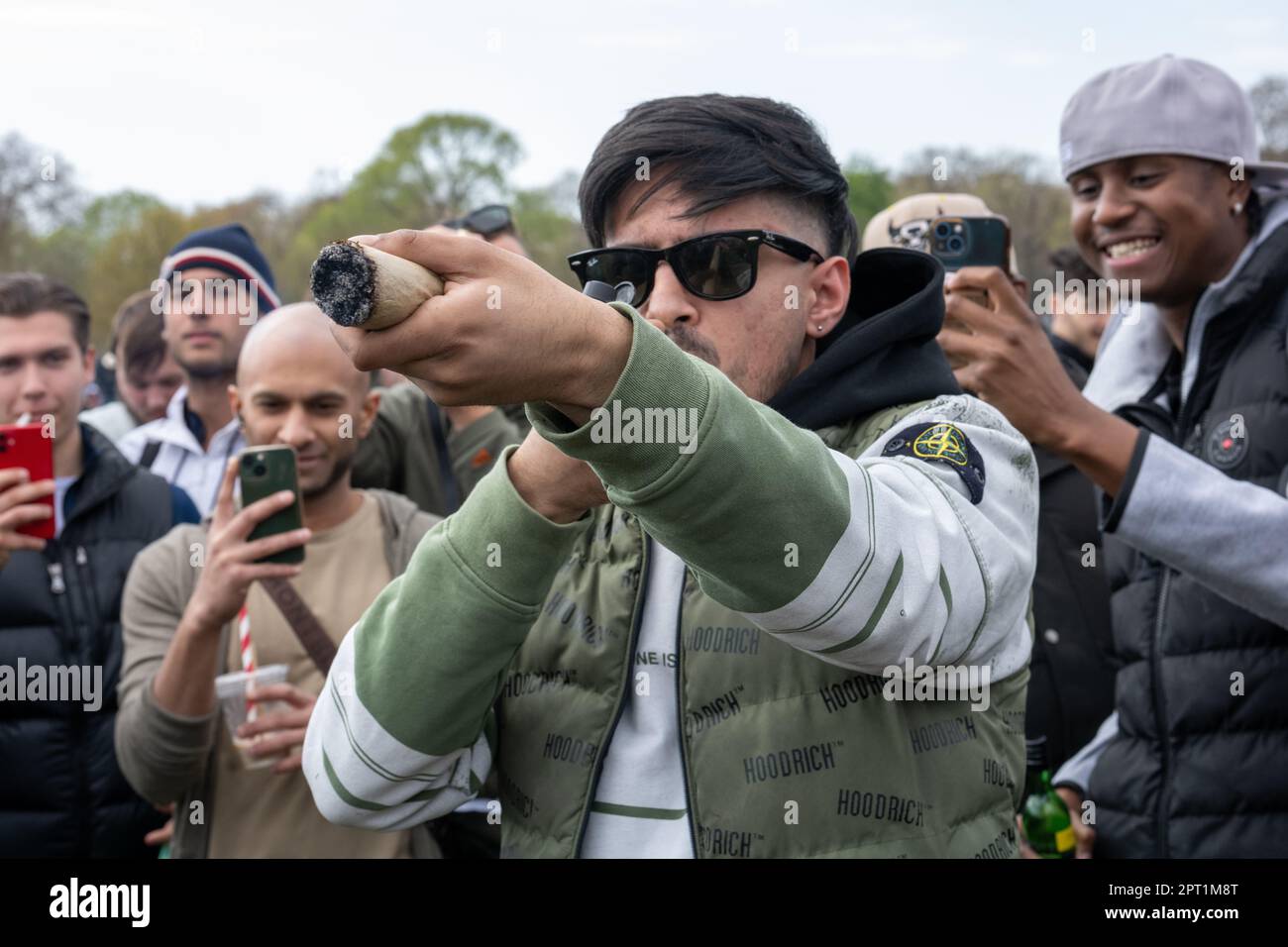 London, UK. 20th Apr, 2023. Bystanders take photos of the giant reefer ...