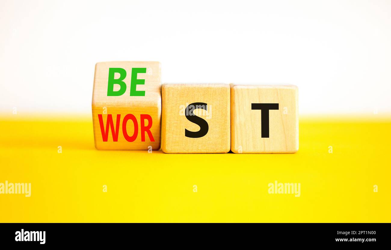 Best or worst symbol. Businessman turns wooden cubes and changes the ...