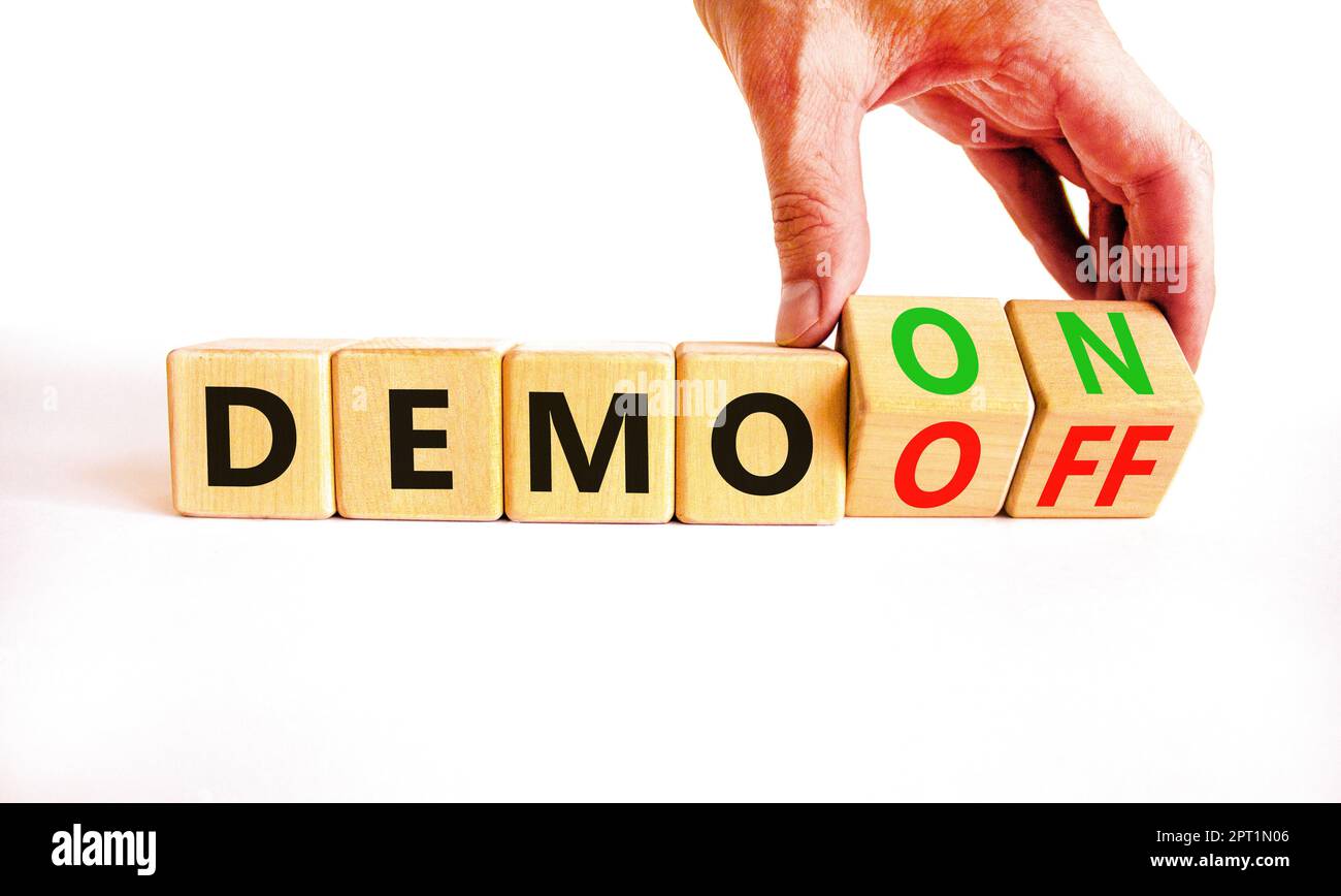 Demo on or off symbol. Businessman turns wooden cubes and changes word ...