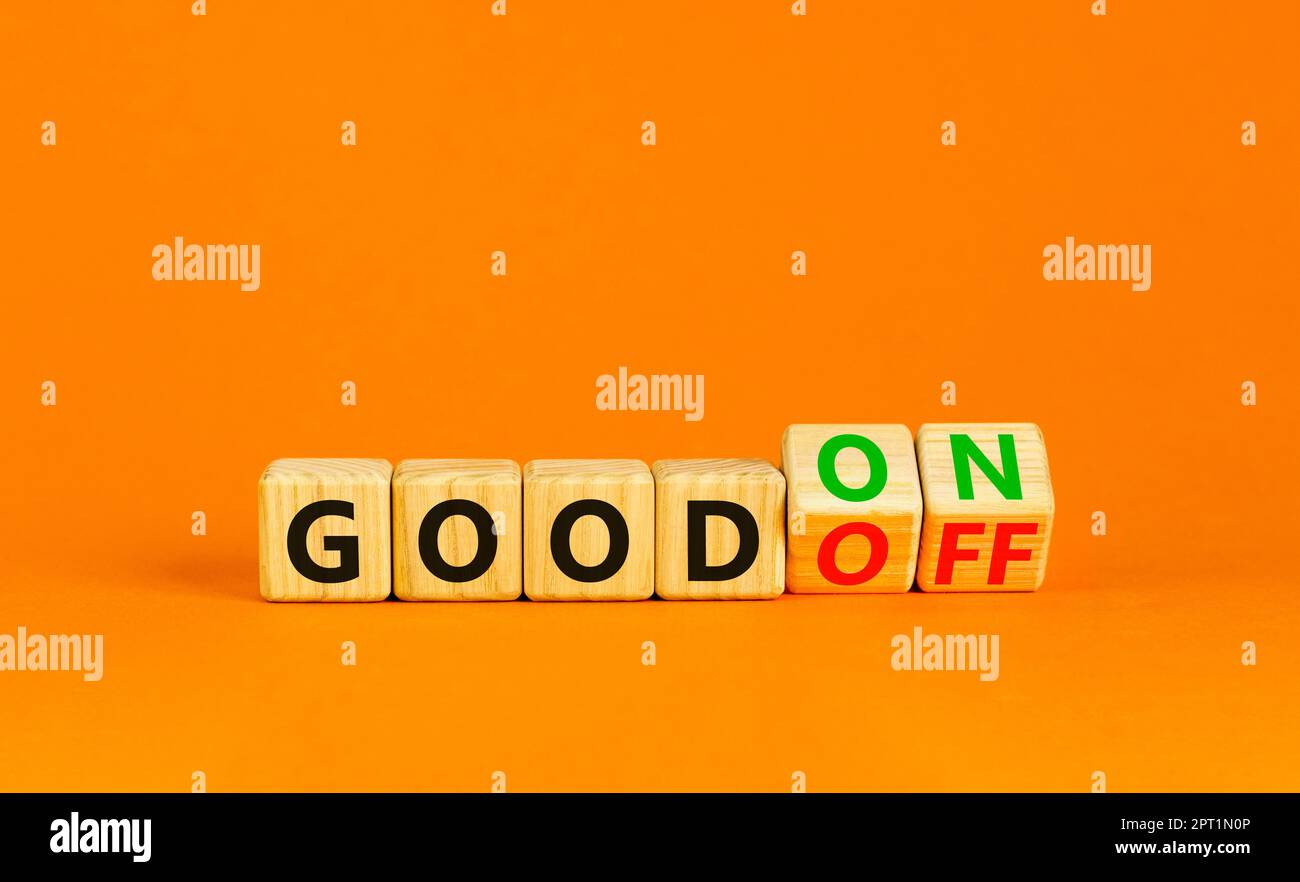 Good on or off symbol. Businessman turns wooden cubes and changes word ...